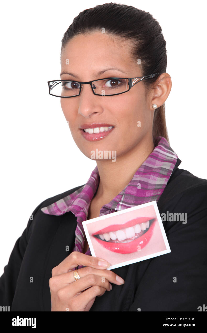Smart woman holding card on white background Stock Photo - Alamy