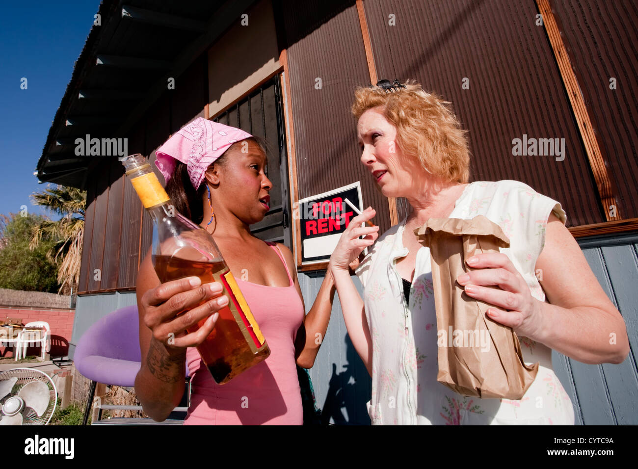 Portrait of two trashy drunk women outdoors Stock Photo - Alamy