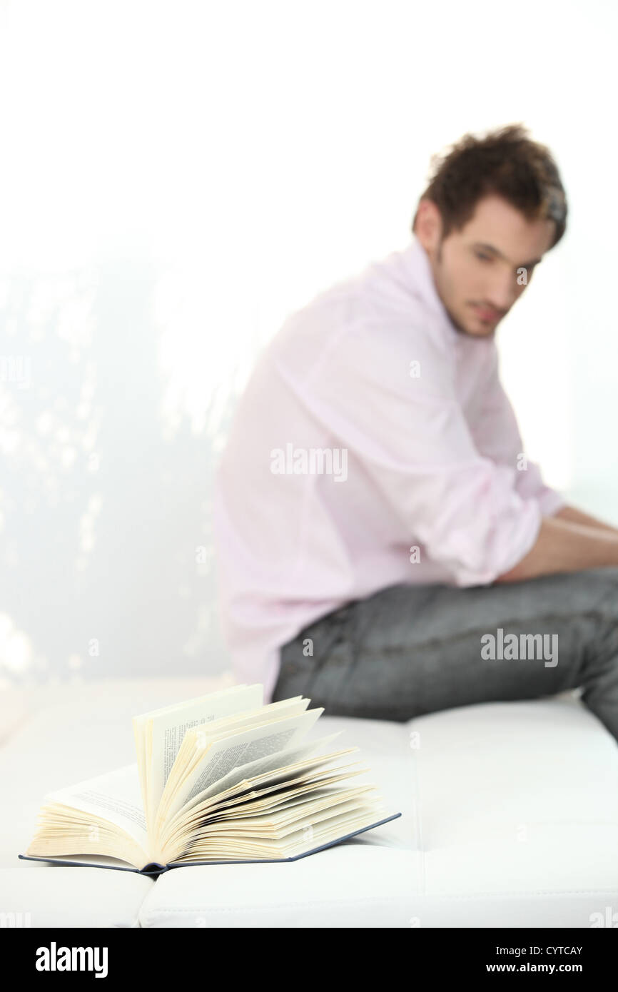 a man in trouble and a book Stock Photo - Alamy