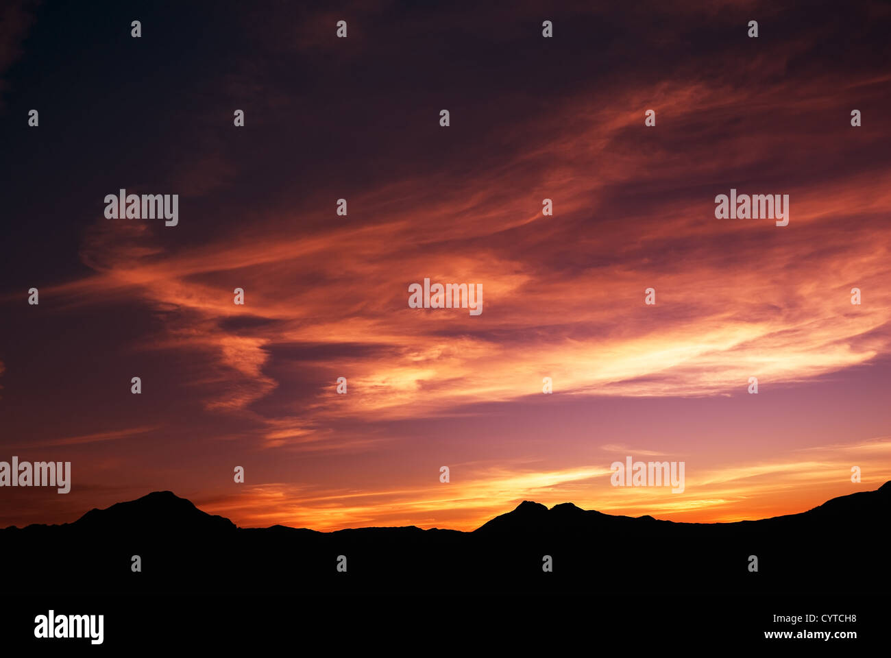 high mountain silhouette with beautiful colorful clouds Stock Photo - Alamy