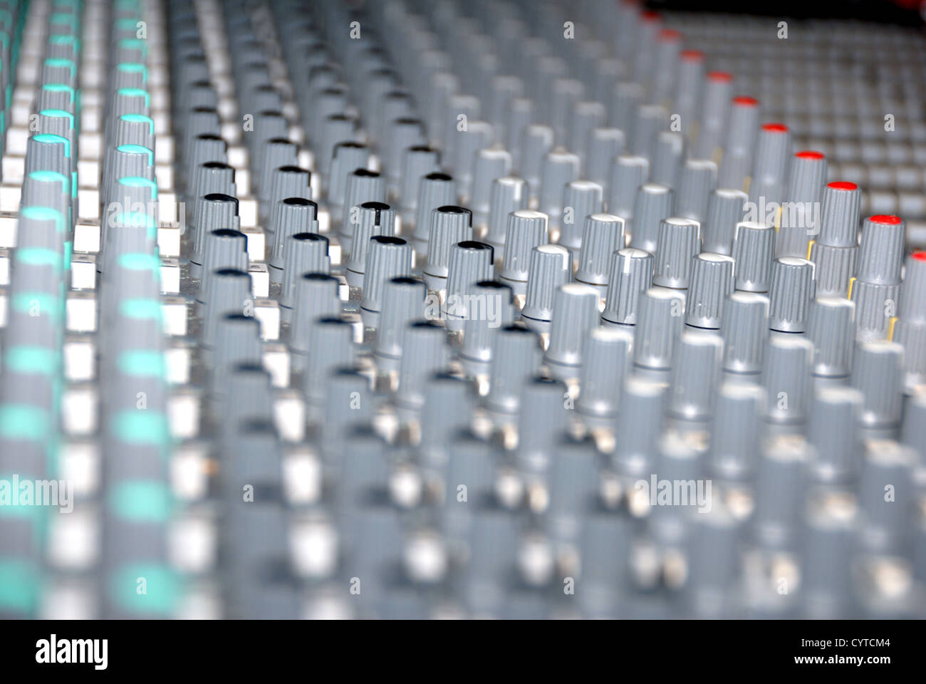 Audio mixing console in a recording studio. Faders and knobs of a sound ...
