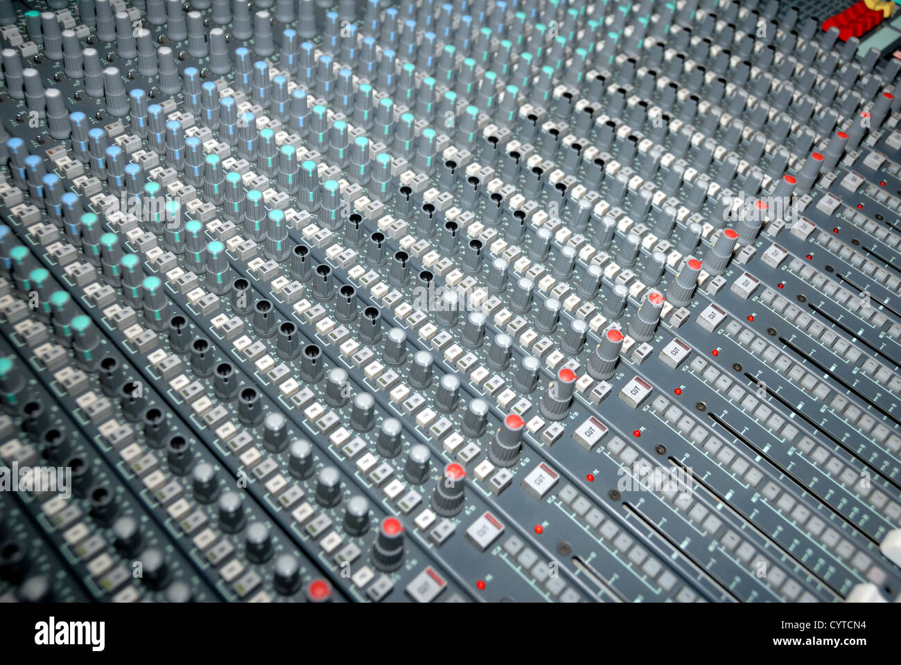 Audio mixing console in a recording studio. Faders and knobs of a sound ...