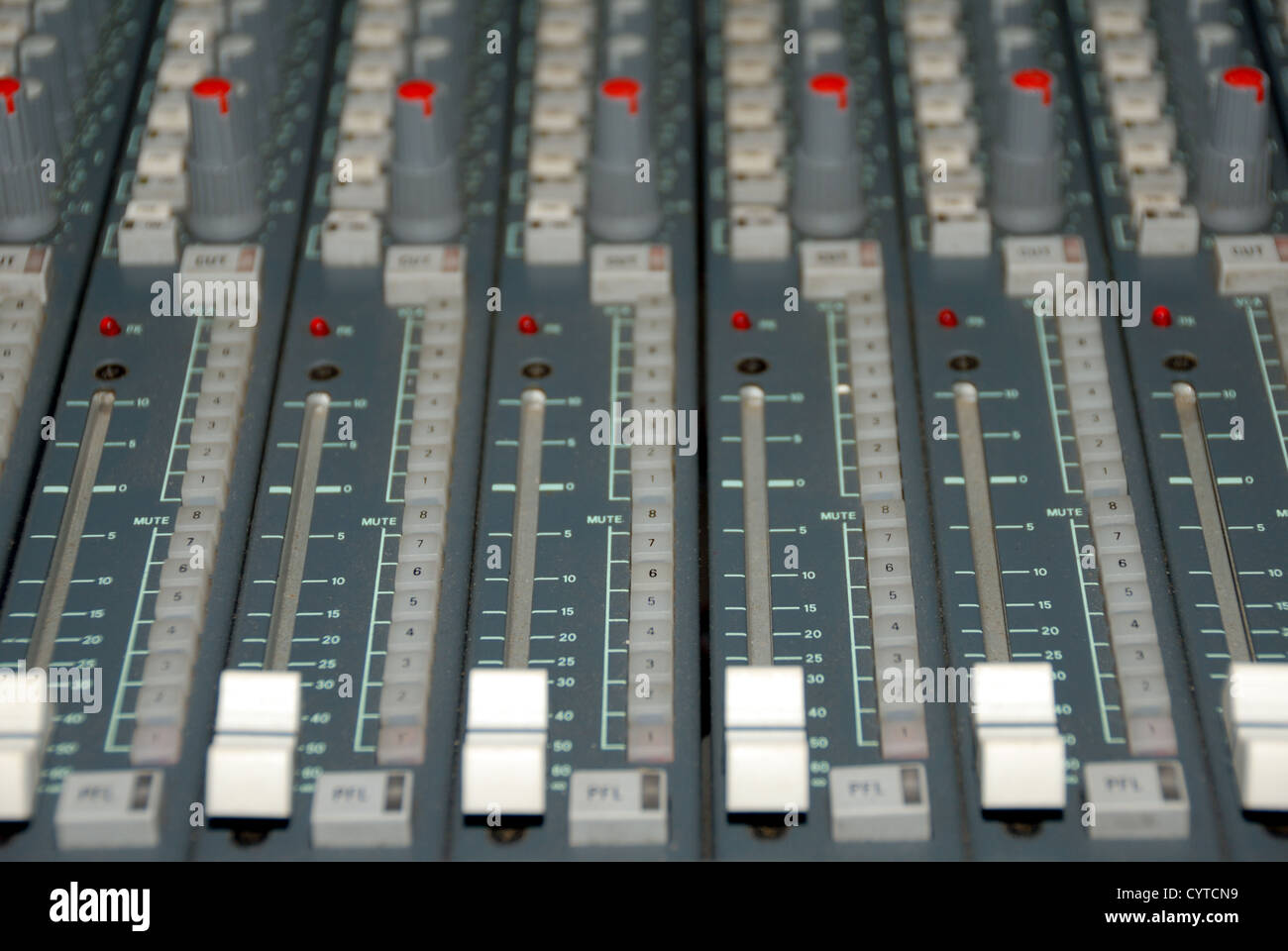 Audio mixing console in a recording studio. Faders and knobs of a sound ...