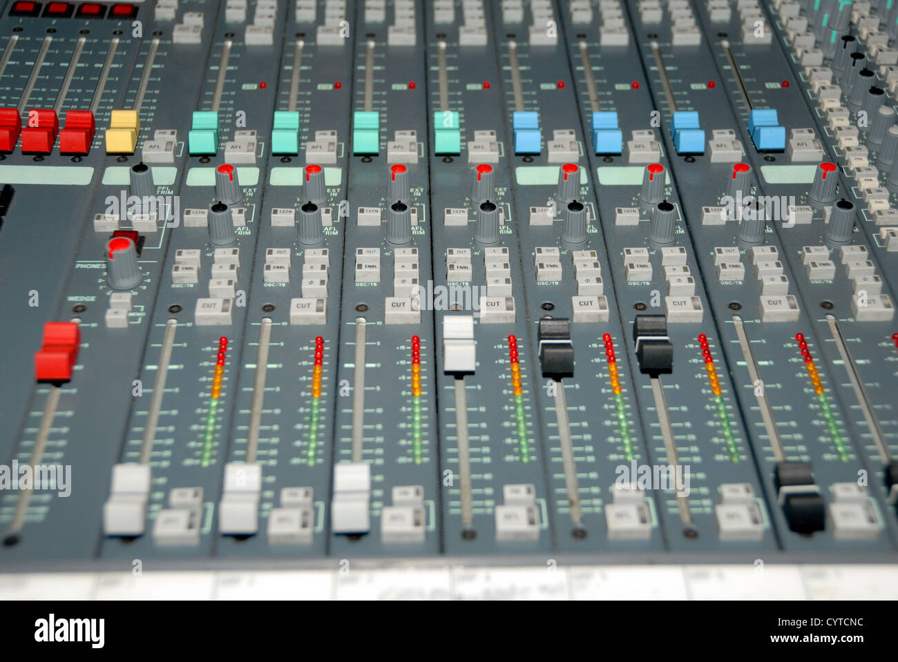 Audio mixing console in a recording studio. Faders and knobs of a sound ...