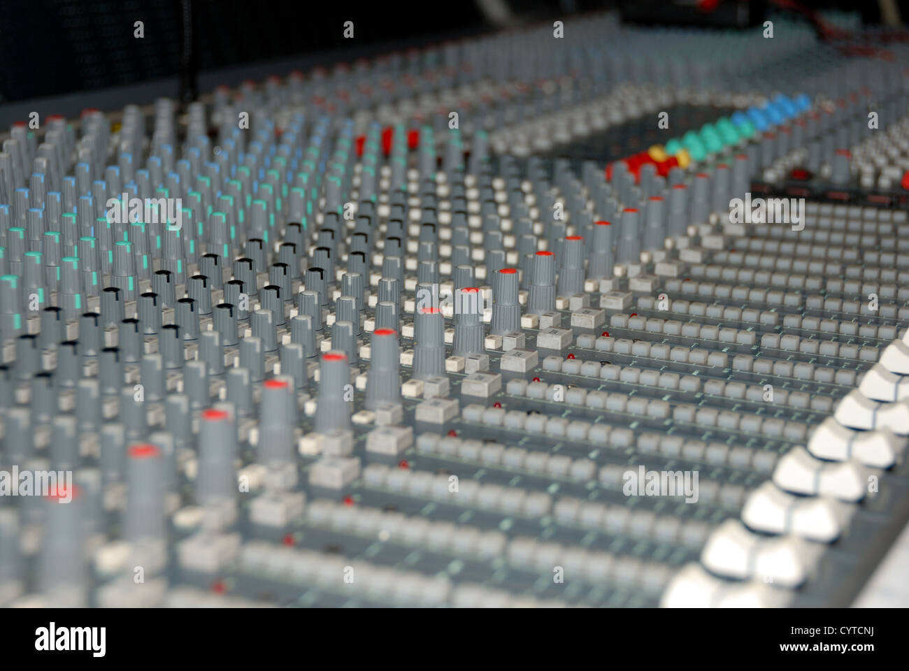 Audio mixing console in a recording studio. Faders and knobs of a sound ...