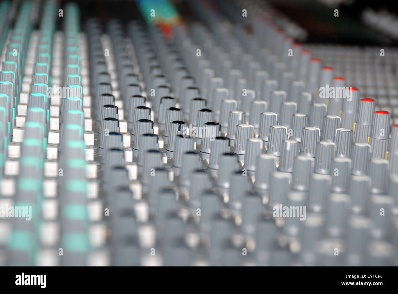 Audio mixing console in a recording studio. Faders and knobs of a sound ...