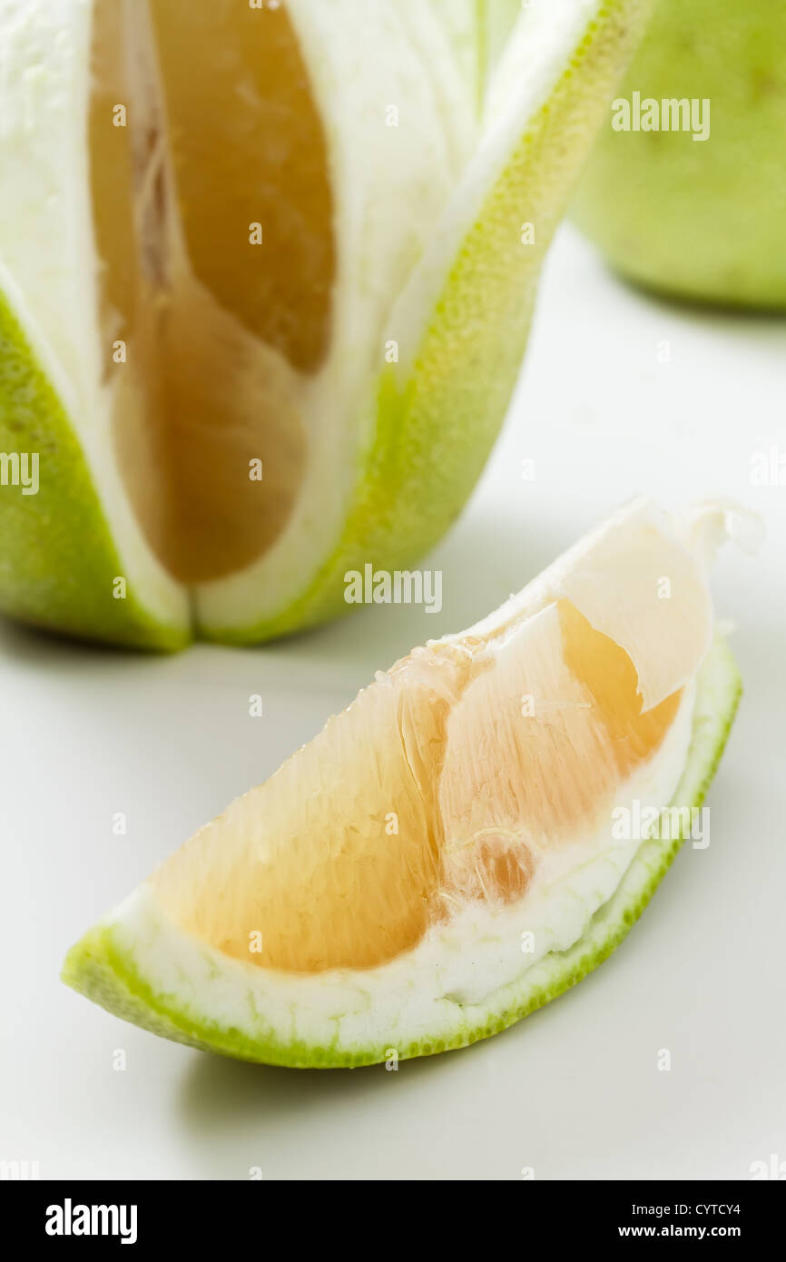 Fresh pomelo fruit peeled on white background Stock Photo - Alamy