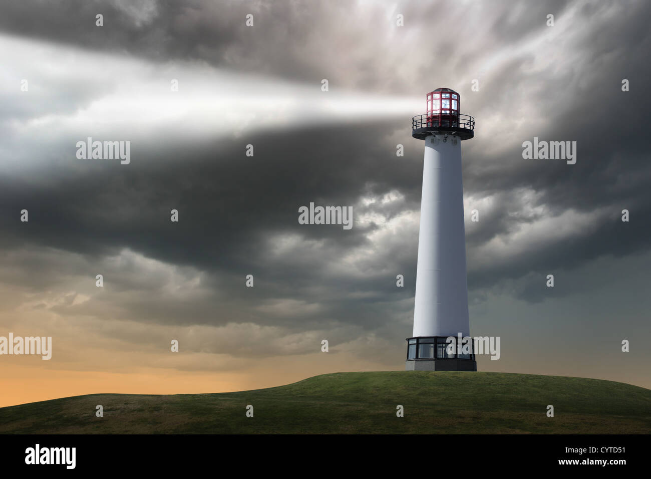 Lighthouse beaming light ray over stormy clouds Stock Photo - Alamy