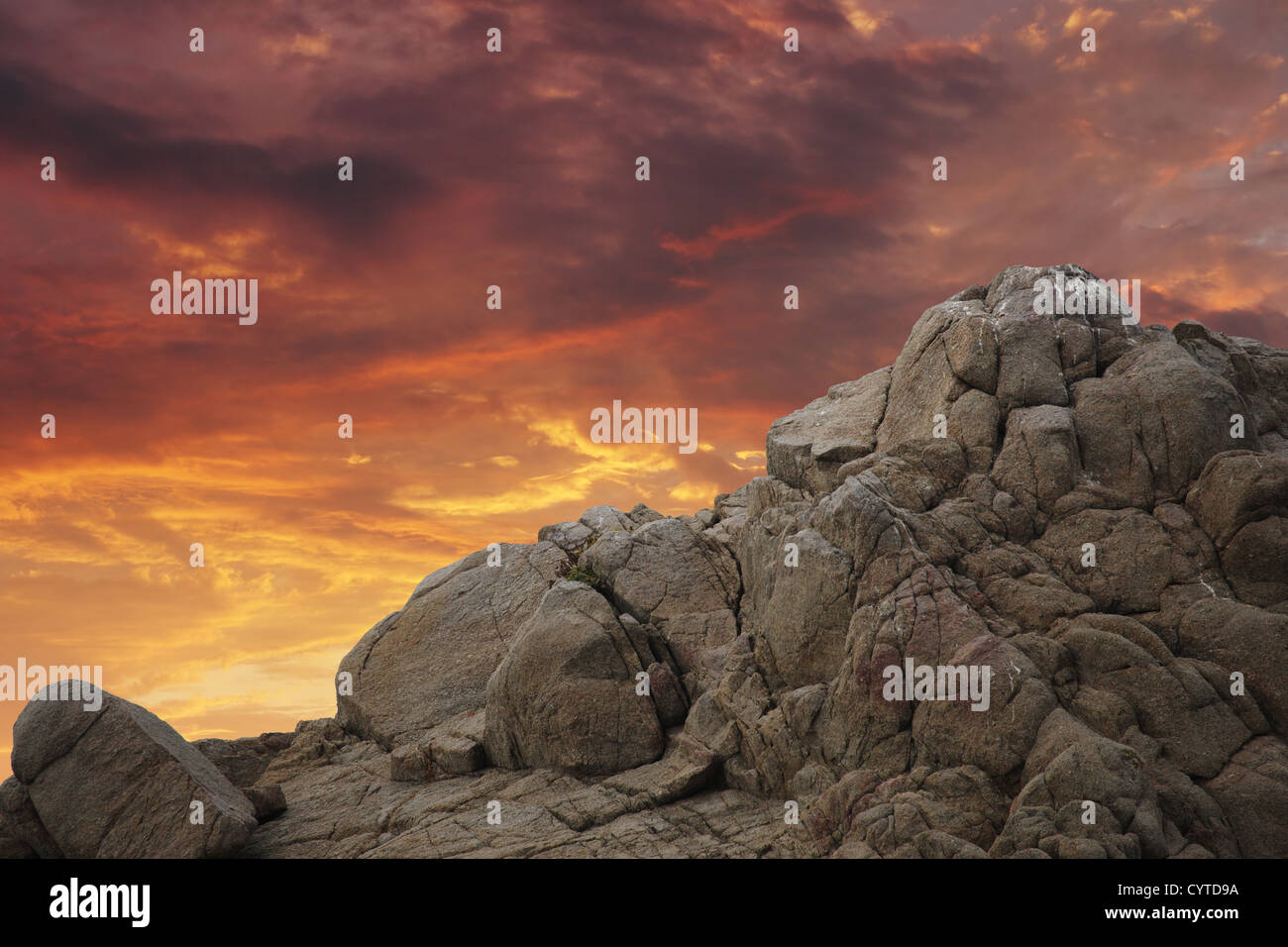 Rock mountain cliff over sunset sky background Stock Photo - Alamy