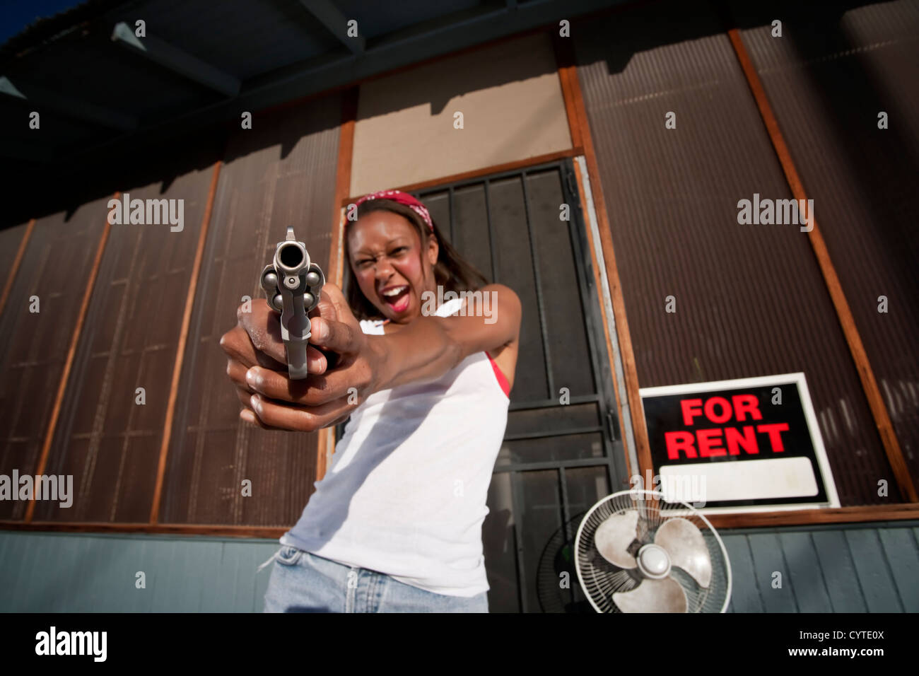 African American woman with a gun on her front porch Stock Photo - Alamy