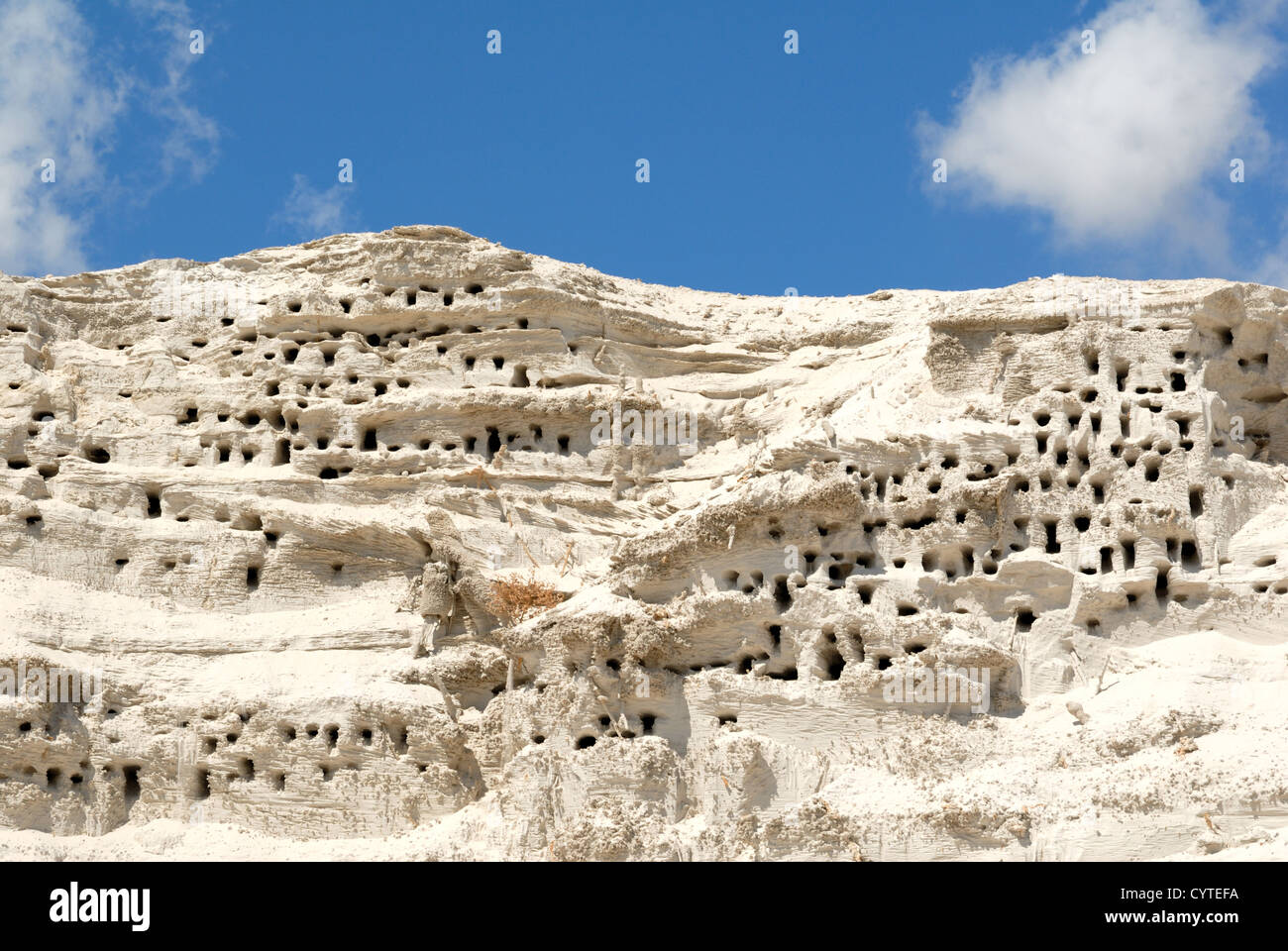 Sandy mountain with the bird's nests against the blue sky Stock Photo ...