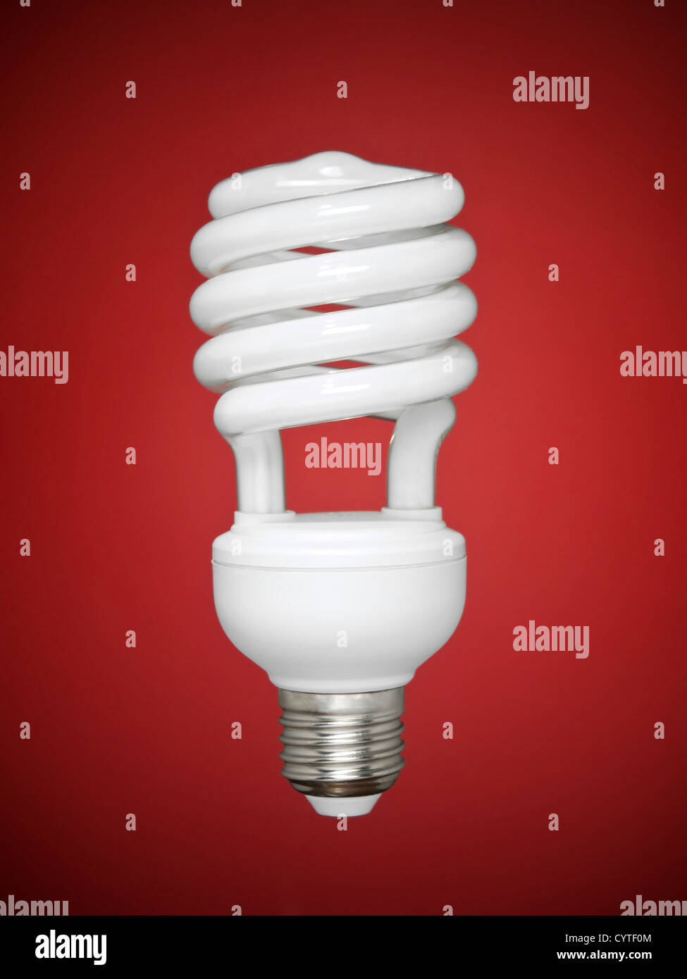 Fluorescent light bulb over red Stock Photo - Alamy