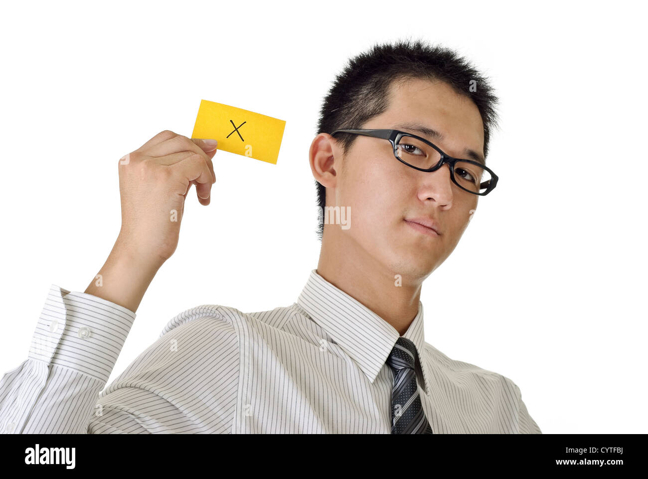 X sign on yellow card holding by business man, closeup portrait of ...