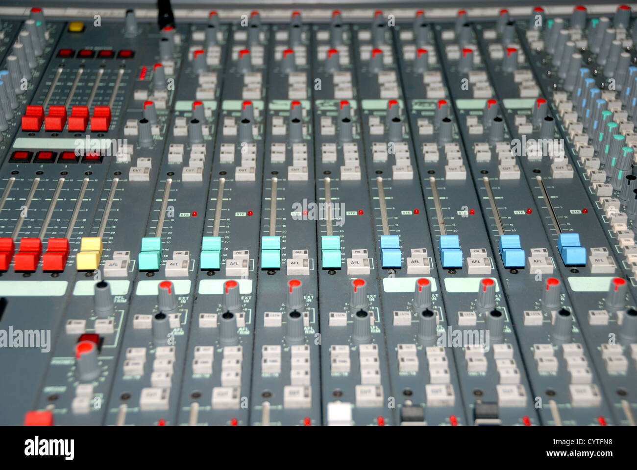 Audio mixing console in a recording studio. Faders and knobs of a sound ...