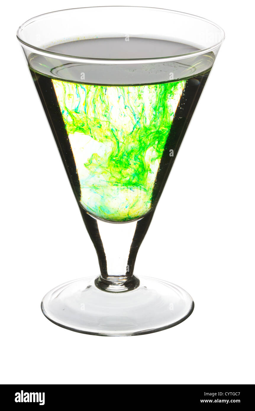 Glass with a dissolved green paint Stock Photo - Alamy