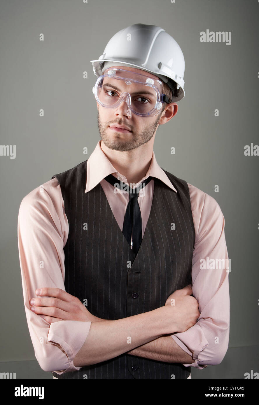Handsome young man in hard hat and safety goggles Stock Photo - Alamy