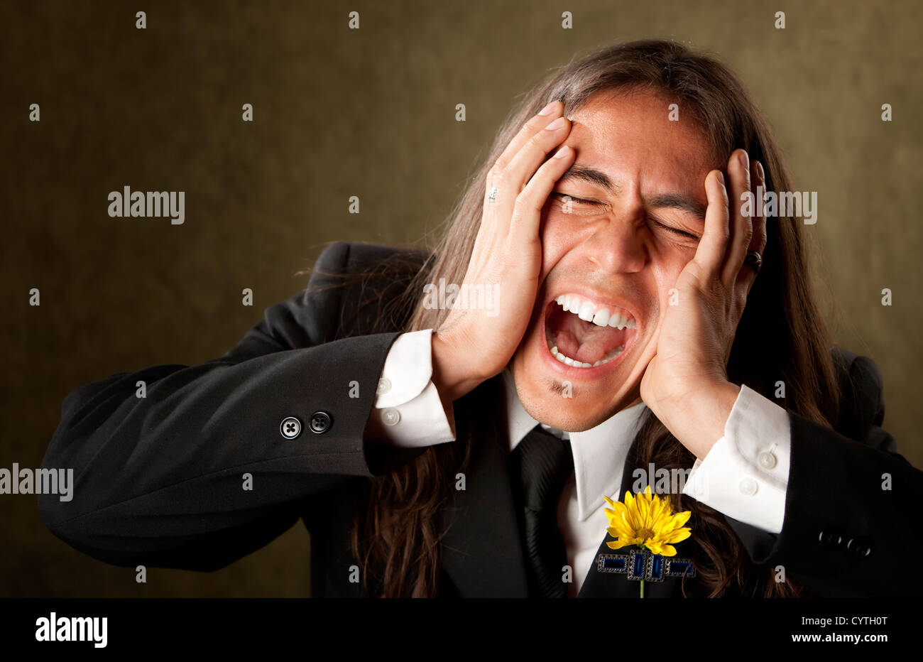 Handsome man screaming in formal jacket with boutonniere Stock Photo ...