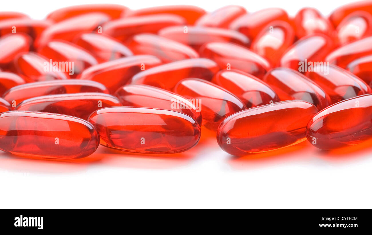 red tablets isolated on white background Stock Photo - Alamy