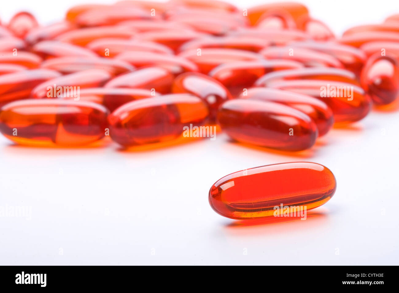 red tablets isolated on white background Stock Photo - Alamy