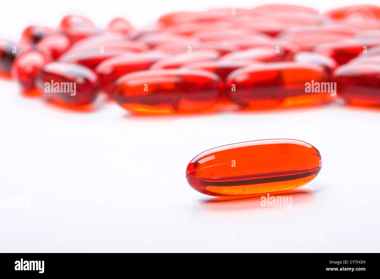 red tablets isolated on white background Stock Photo - Alamy