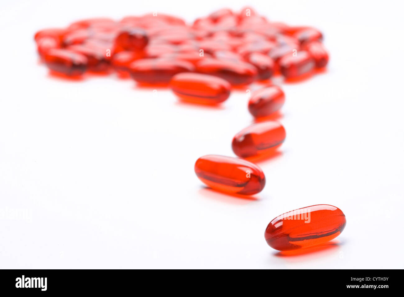 red tablets isolated on white background Stock Photo - Alamy