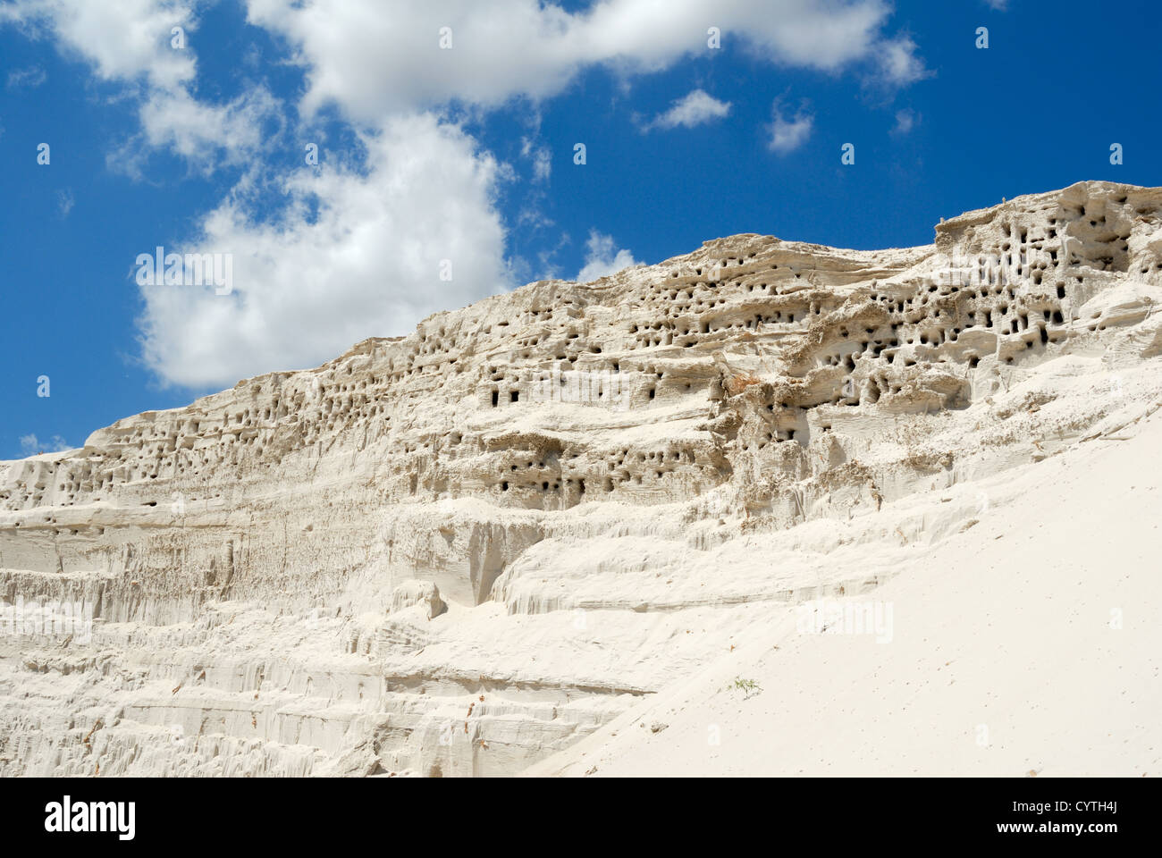 Sandy mountain with the bird's nests against the blue sky Stock Photo ...