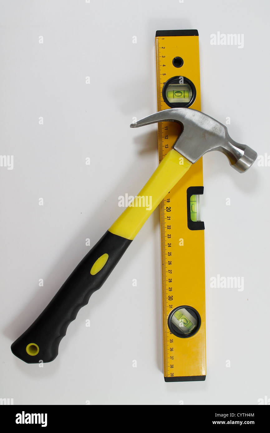 Claw hammer and spirit level Stock Photo - Alamy