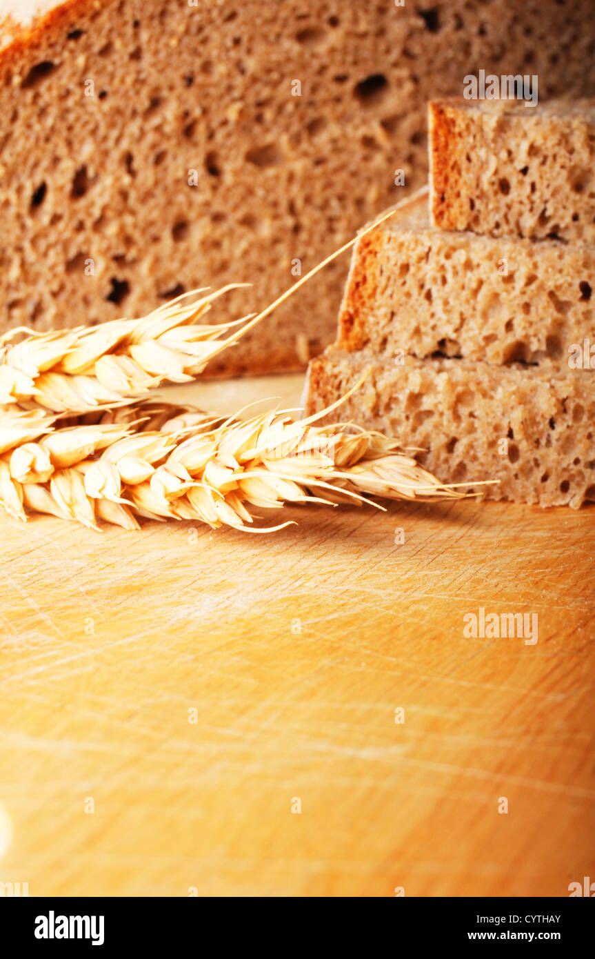 bread on wood surface showing food or bakery concept Stock Photo - Alamy