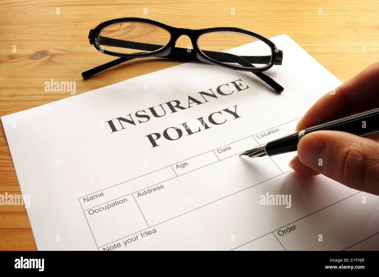 insurance policy form on desk in office showing risk concept Stock ...