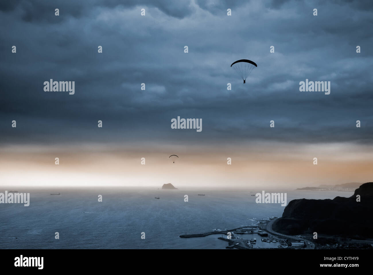 It is a kind of sport called parachuting over the sea Stock Photo - Alamy