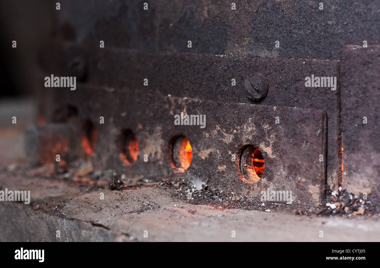 Old rusty coal furnace with hot fire inside Stock Photo - Alamy