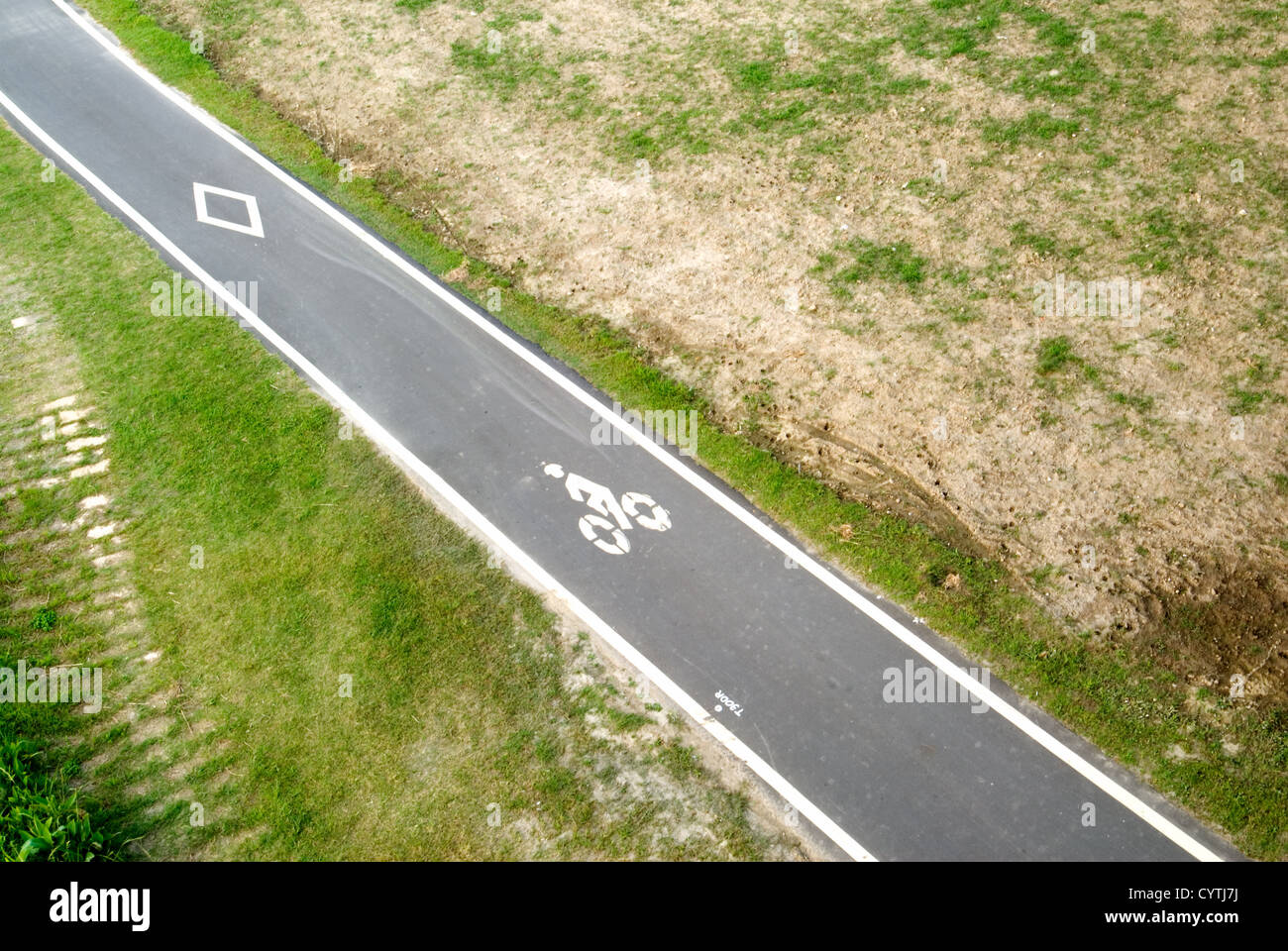 It is a road for bicycle on the grassland Stock Photo - Alamy