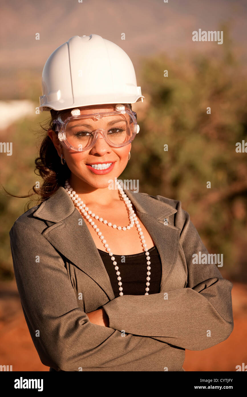 Pretty young woman in hard hat and safety goggles Stock Photo - Alamy