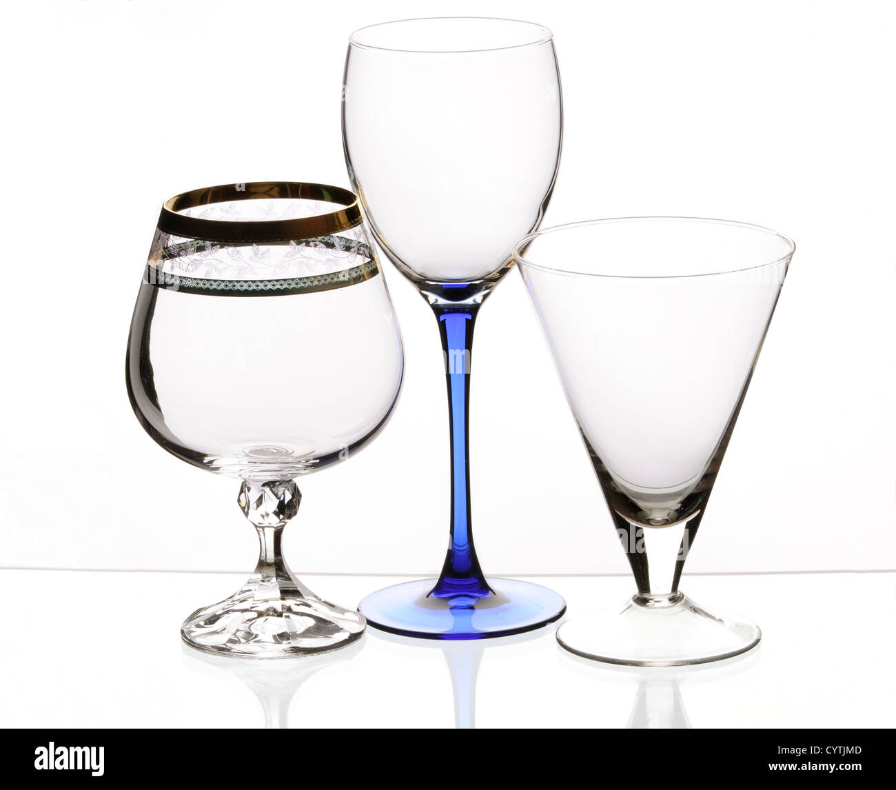 Three transparent empty glasses stand on a table Stock Photo - Alamy