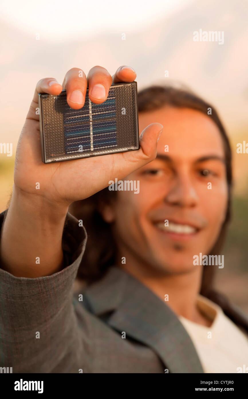 Handsome young mixed race man with small solar panel Stock Photo - Alamy Handsome young mixed race man with small solar panel Stock Photo - Alamy