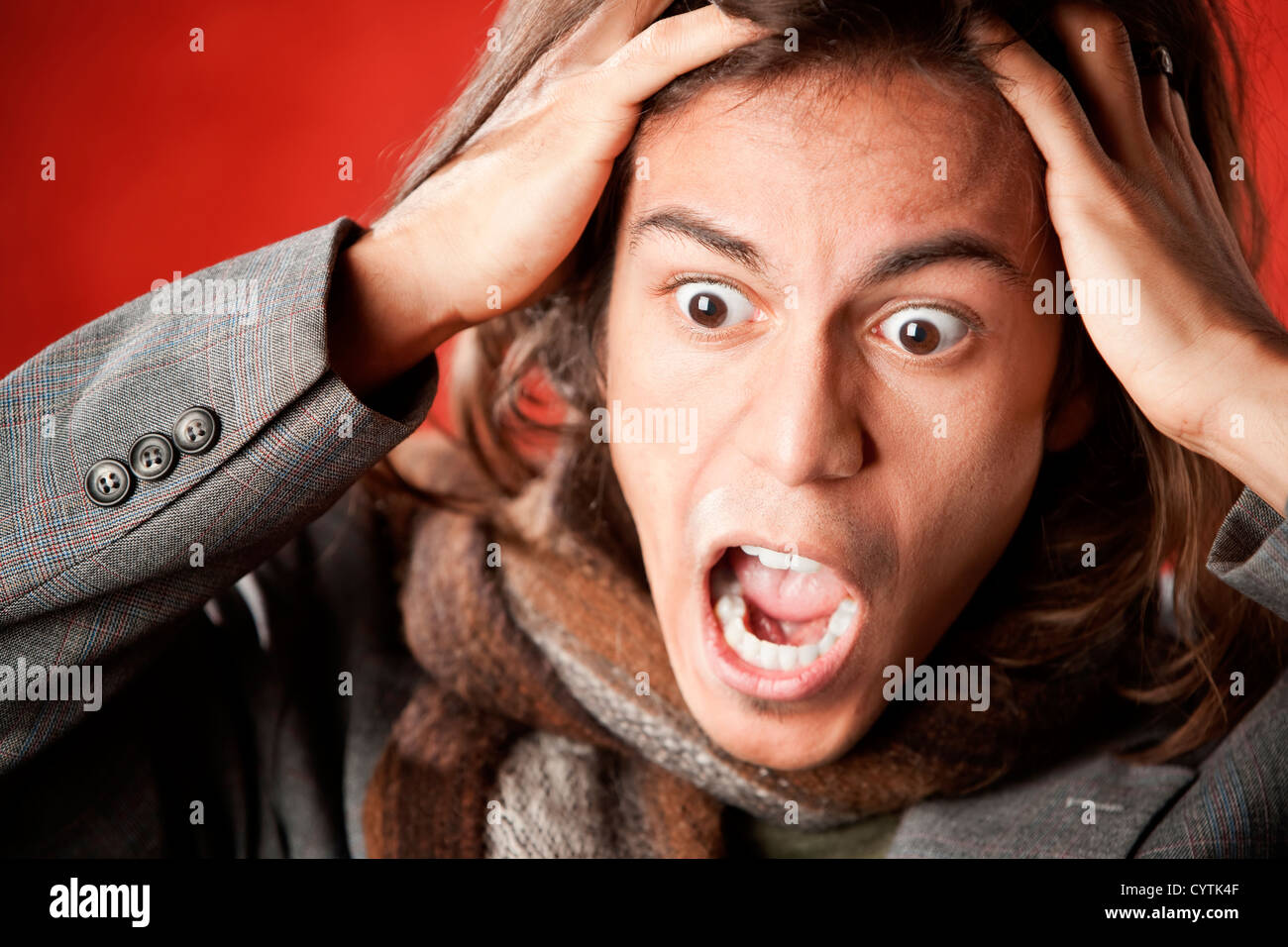 Closeup Portrait of a Handsome Young Man with Long Hair Screaming Stock ...