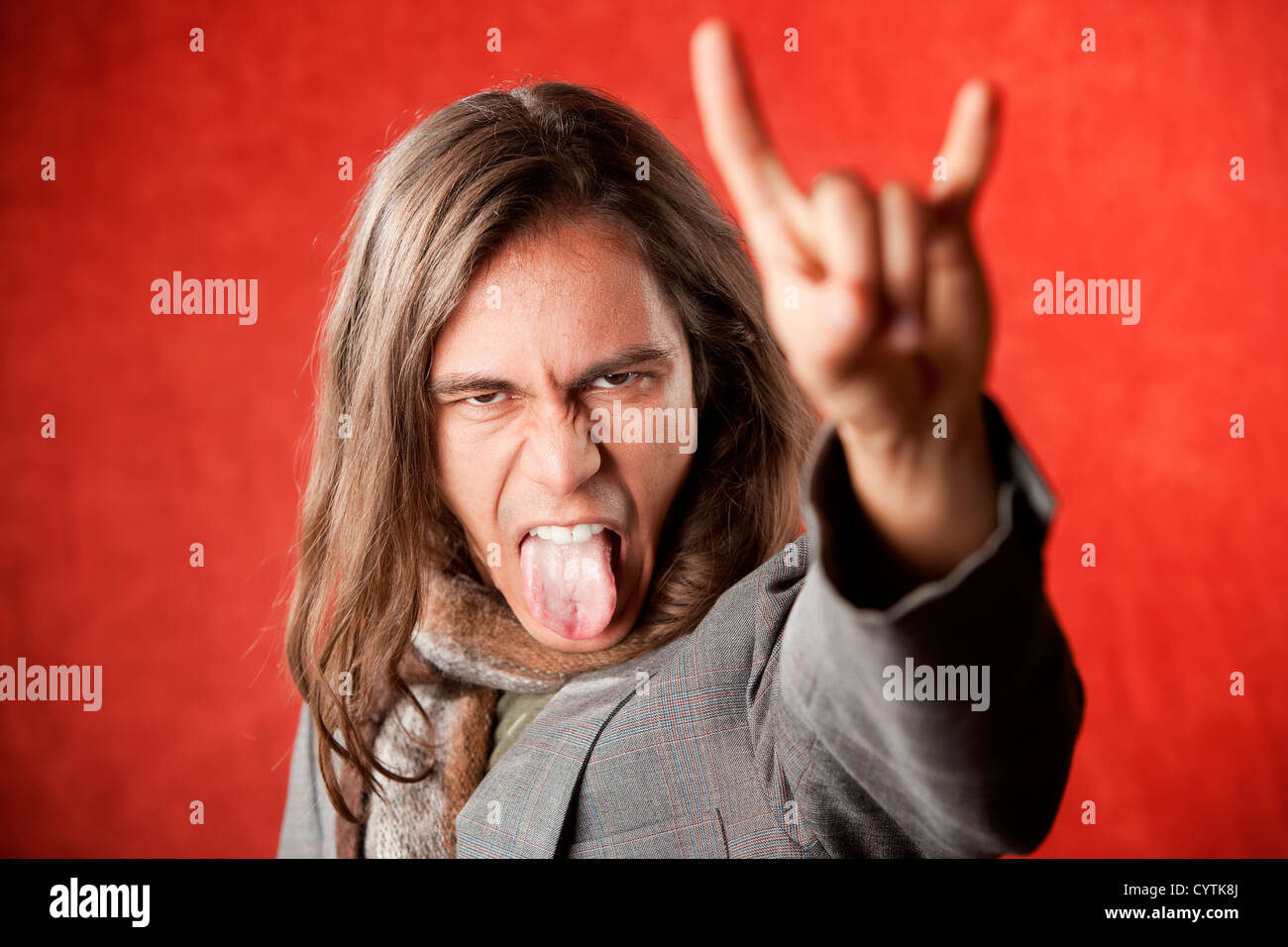 Closeup Portrait of Handsome Young Man with Long Hair Making Hand ...