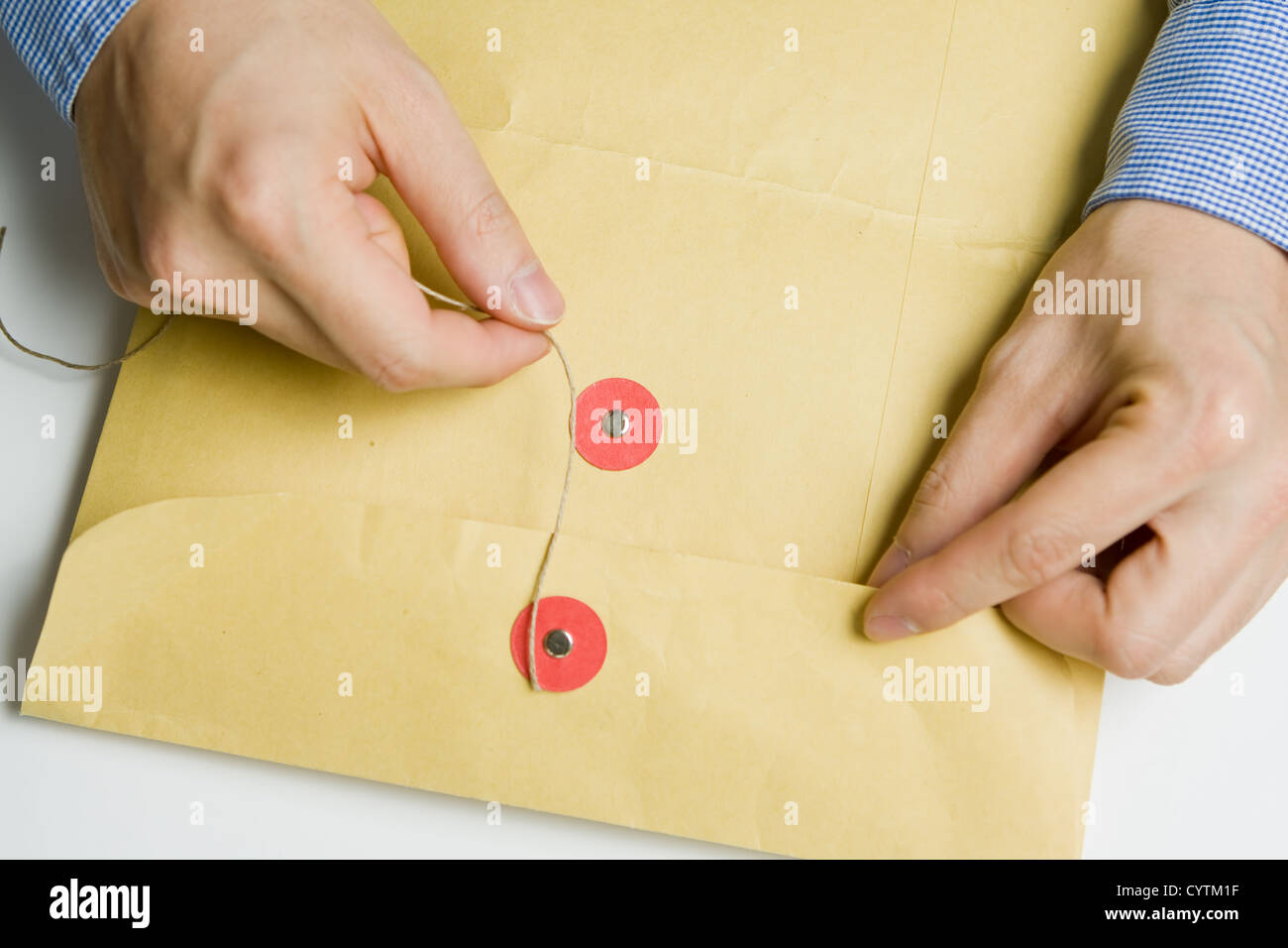 Person opening a confidential official document in an envelope Stock ...