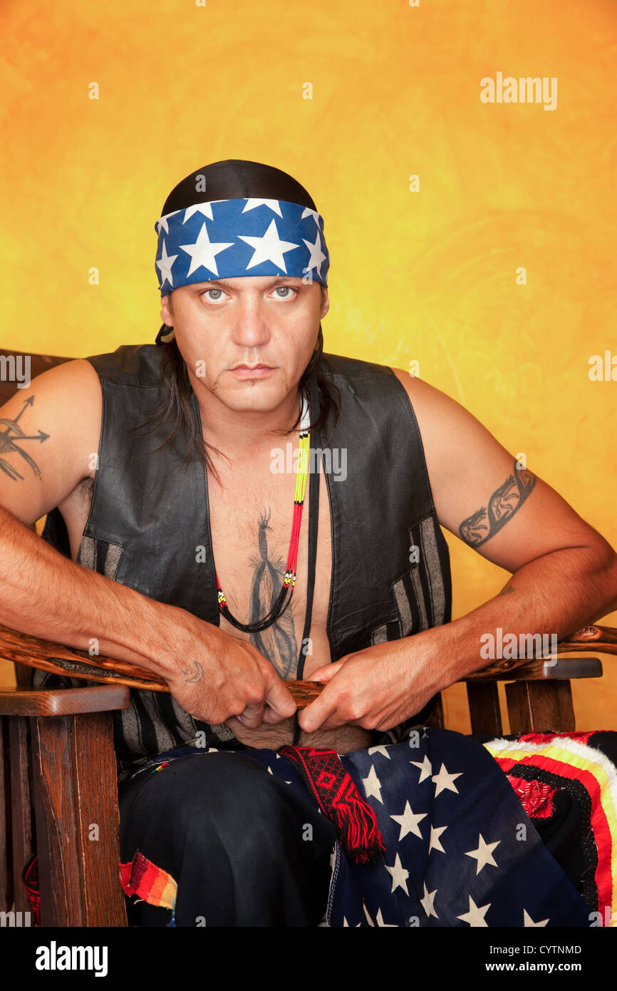 Kneeling Native American man in rocking chair Stock Photo - Alamy