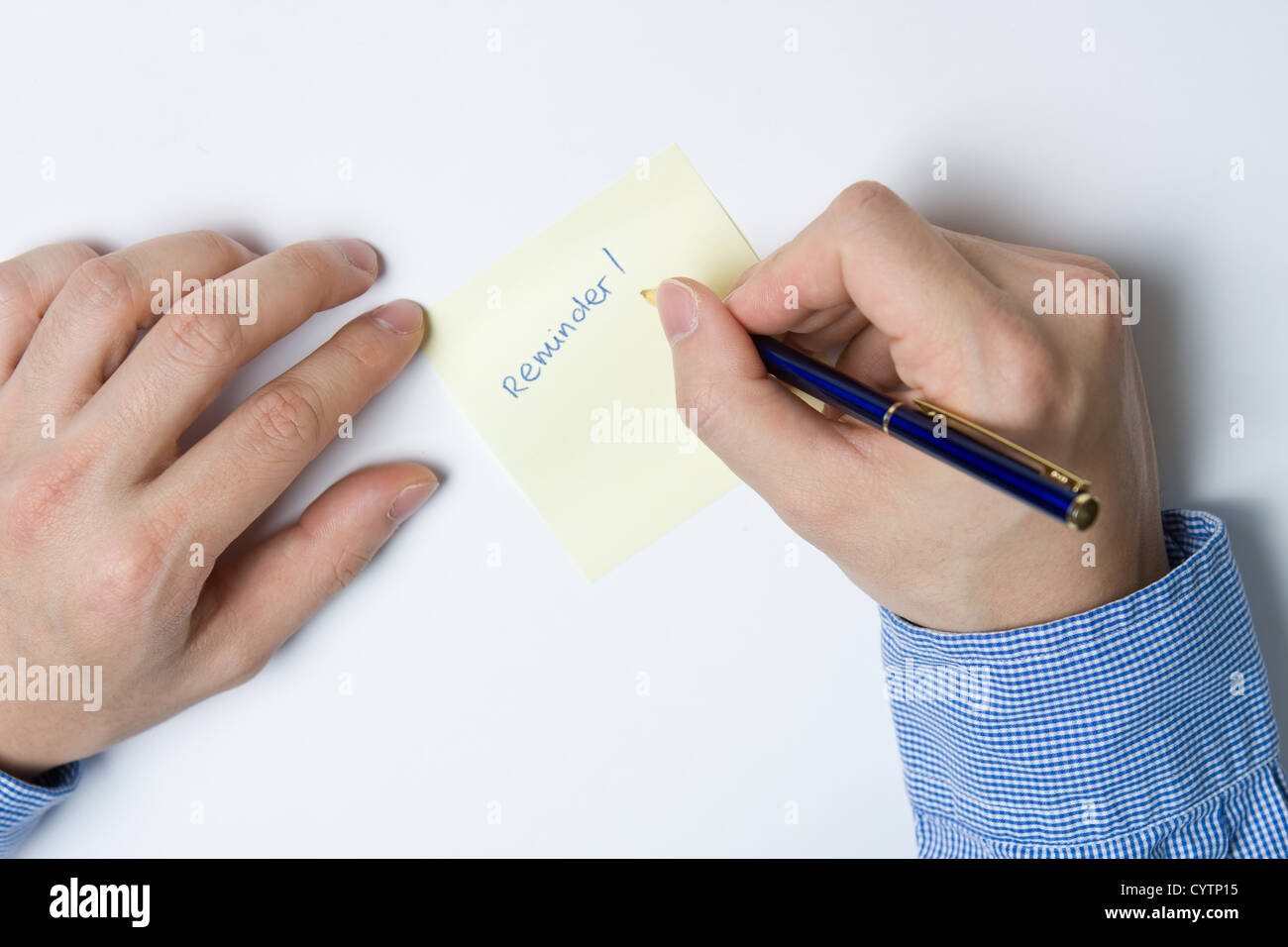 Person writing a message on a piece of paper or note Stock Photo - Alamy