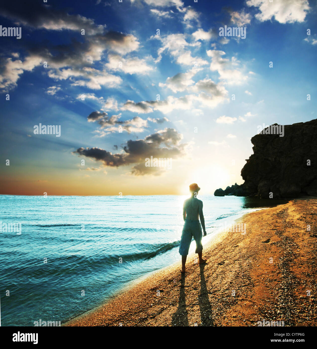 Boy on sea coast Stock Photo - Alamy