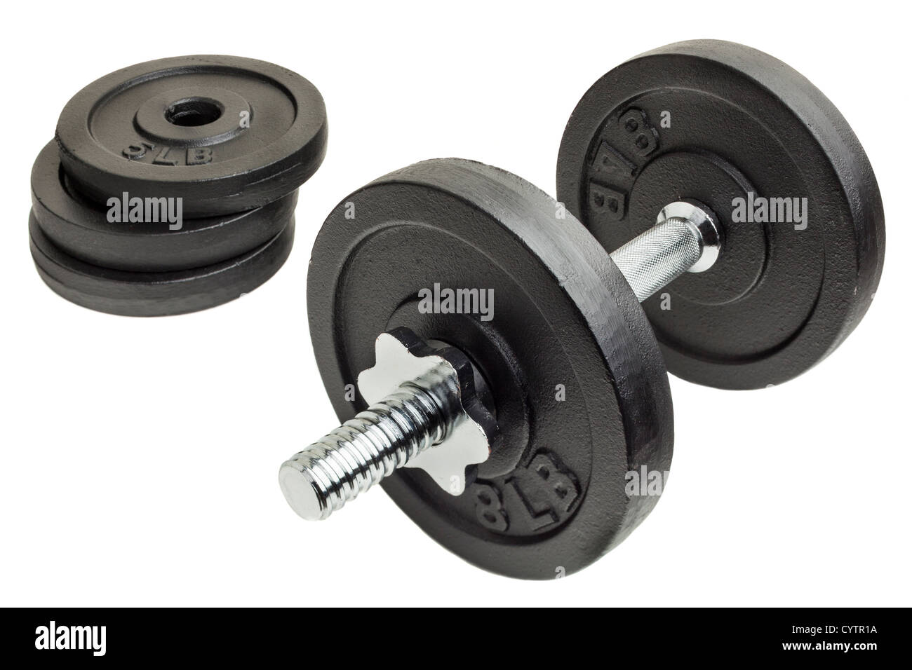 cast iron dumbbell and weight plates isolated on white background Stock ...