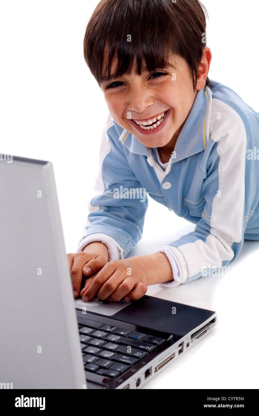 Cute smiling caucasian kid with laptop on isolated white background ...