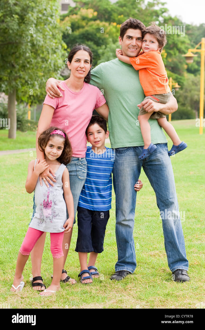 Happy family of five standing together in the park, outdoors Stock ...