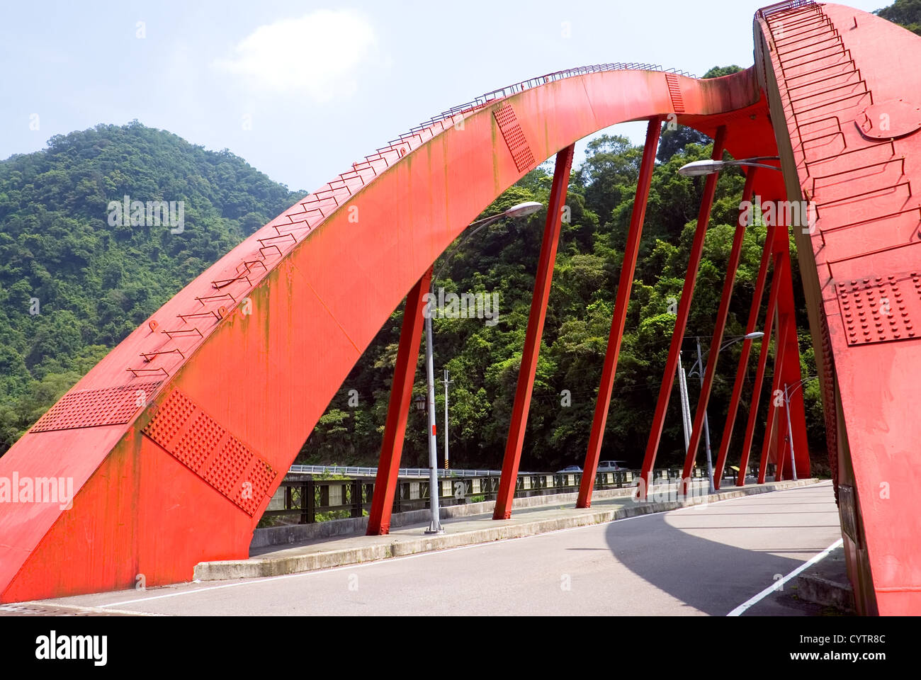 Here is a red big bridge on the land Stock Photo - Alamy