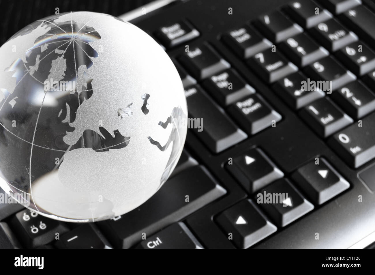 globe and keyboard showing global communication or internet concept ...