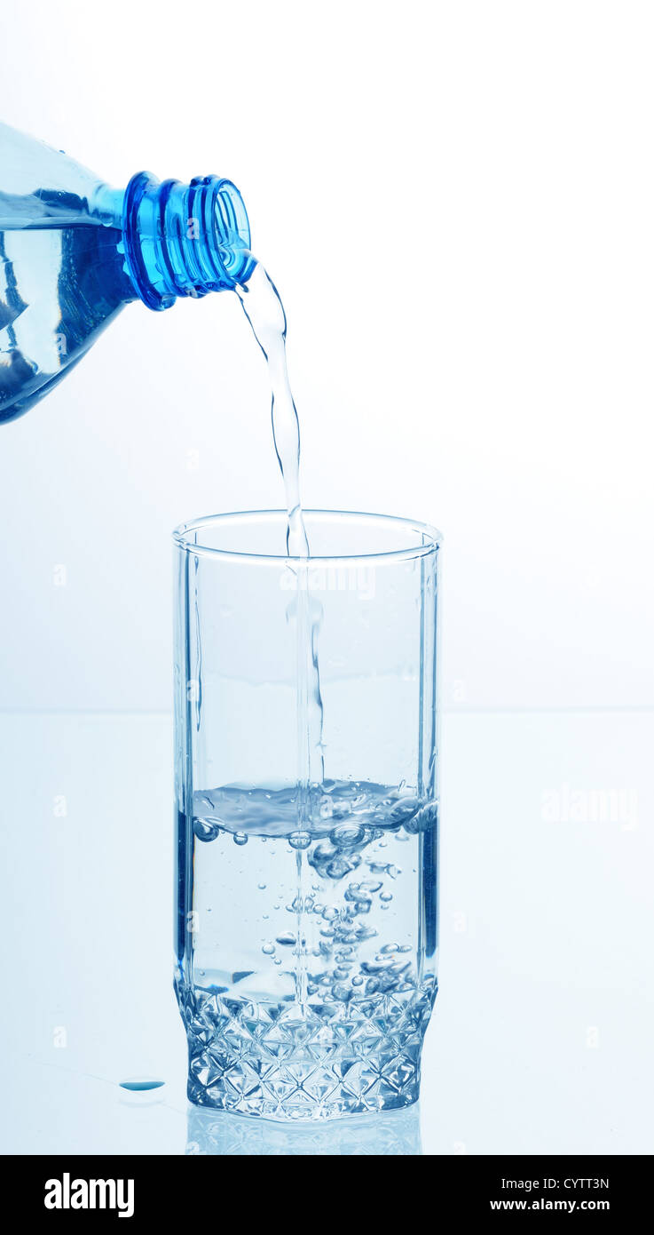 Water from a bottle lit in a glass Stock Photo - Alamy