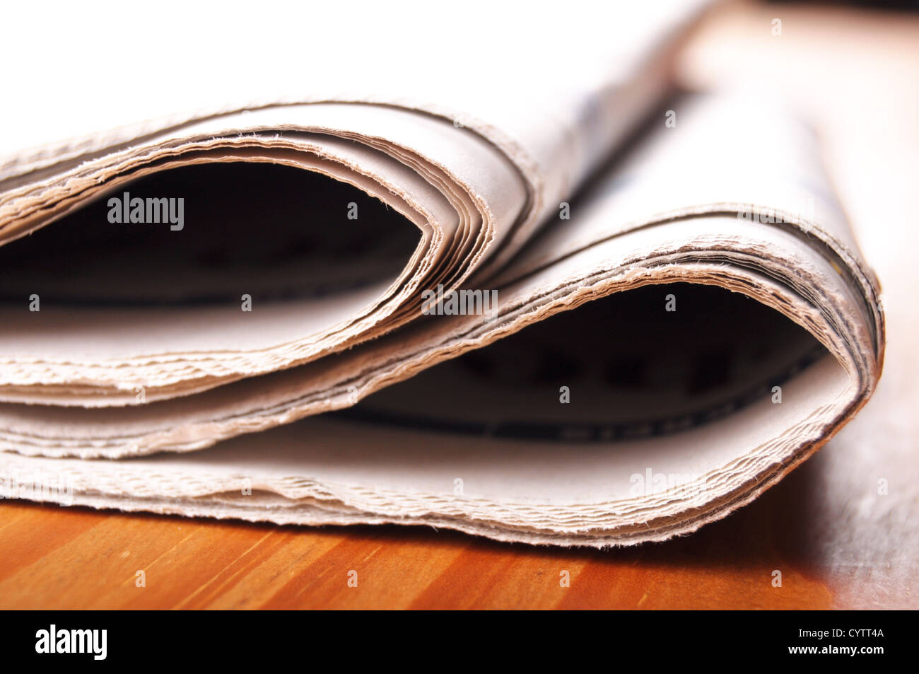 stack of newspaper on desktop showing news concept Stock Photo - Alamy