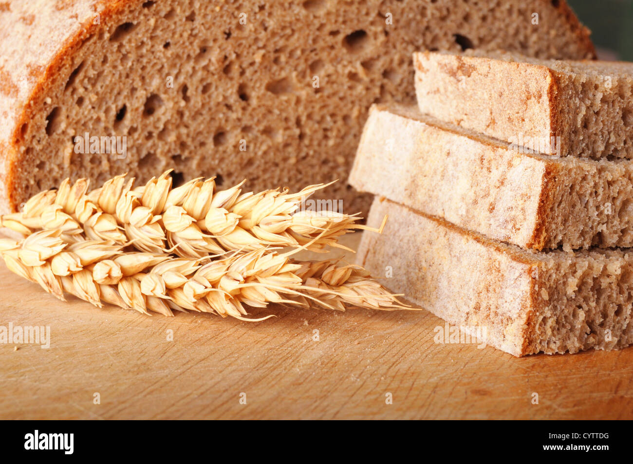 bread on wood surface showing food or bakery concept Stock Photo - Alamy