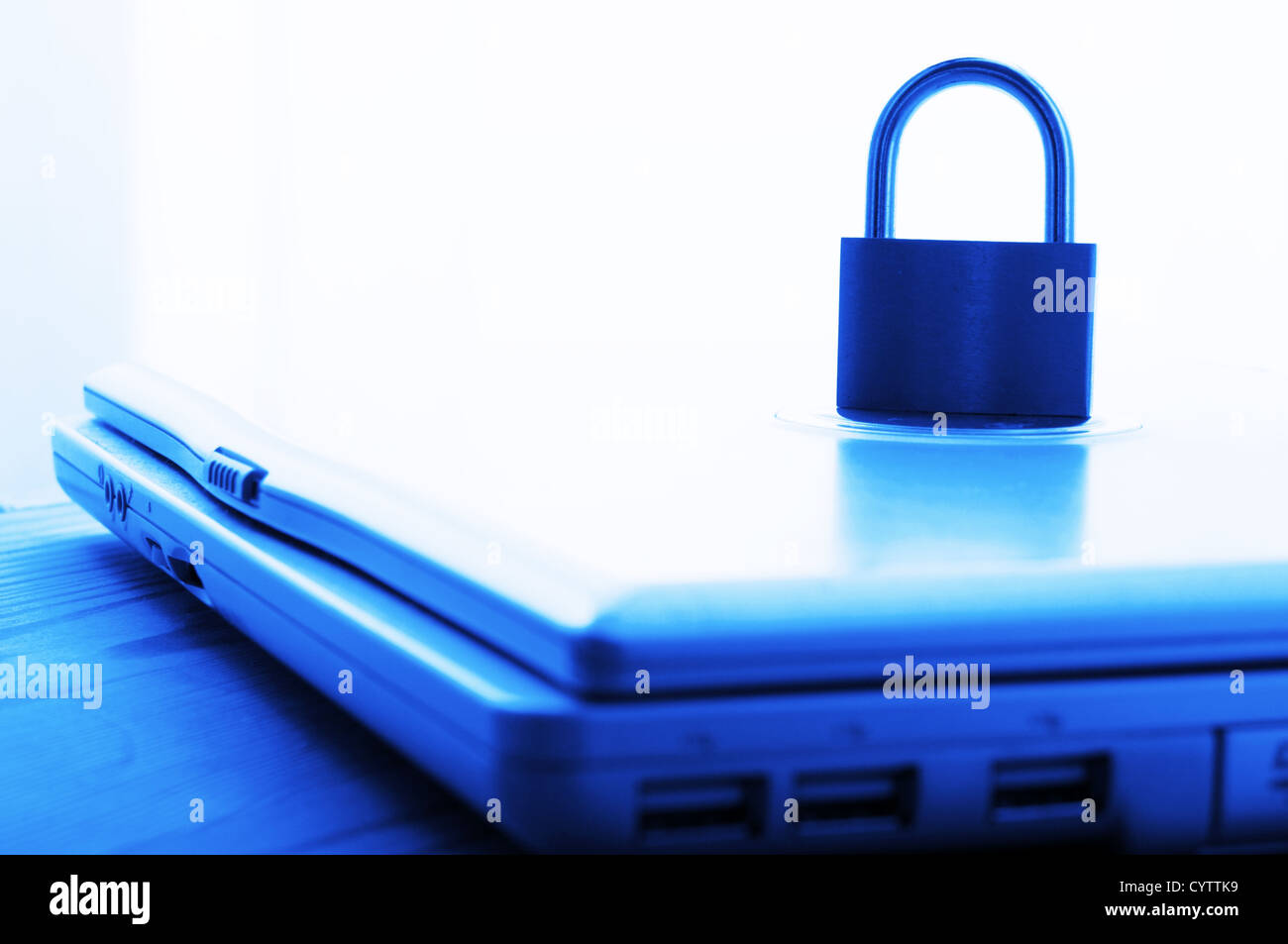 notebook and padlock showing internet or data security concept in blue ...